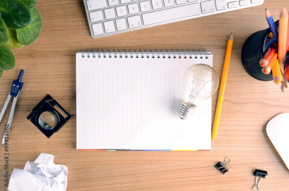 Top view of office desk with paper, stationery, computer, flower, blank ...