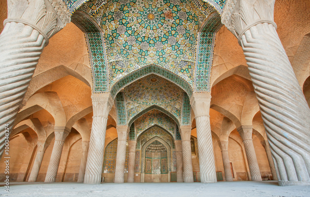 Persian patterns on the ceiling of mosque with columns and artworks ...