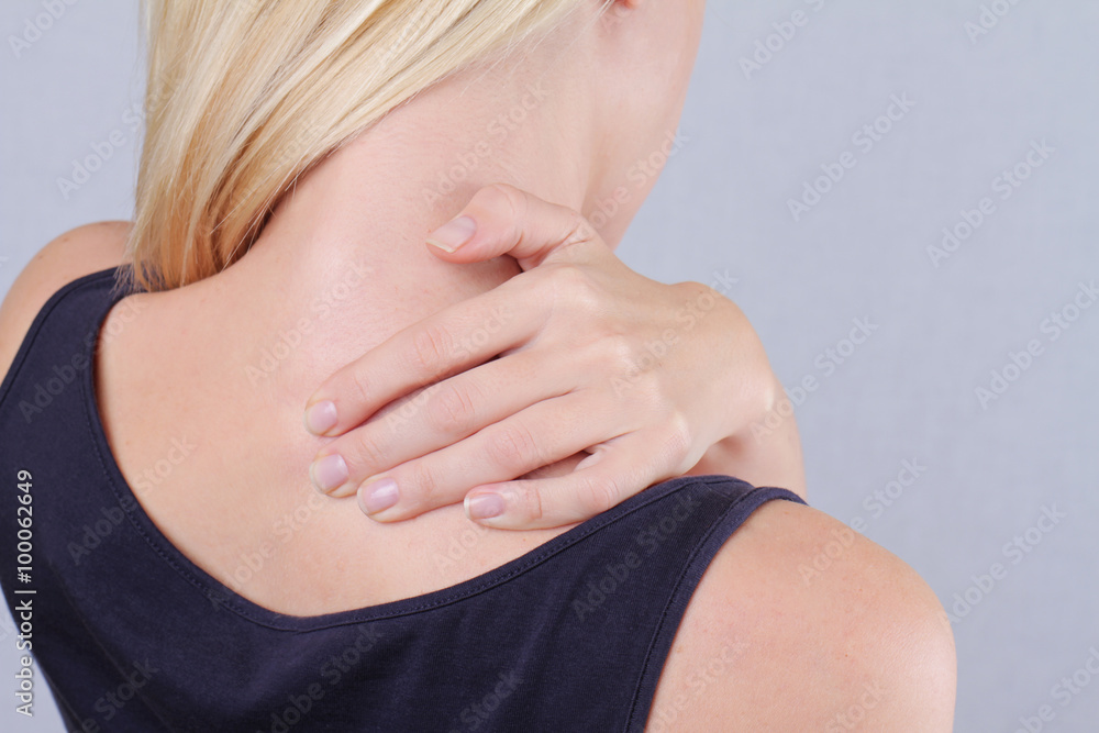 Woman with neck pain. Woman rubbing his painful neck close up. Pain ...