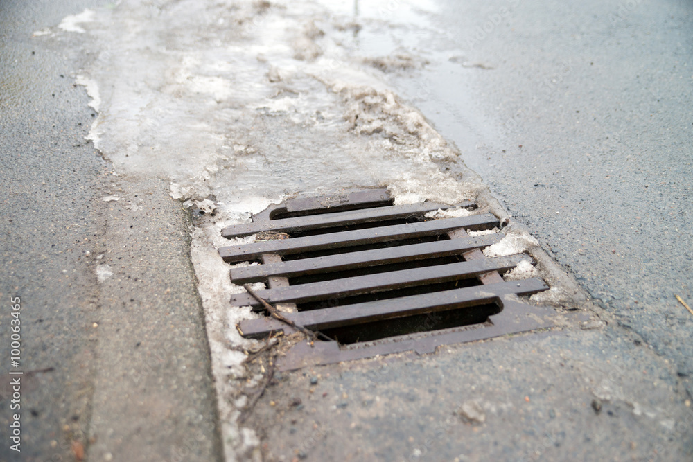 Gully on a road / Gully on a road with snow and ice Stock Photo | Adobe ...