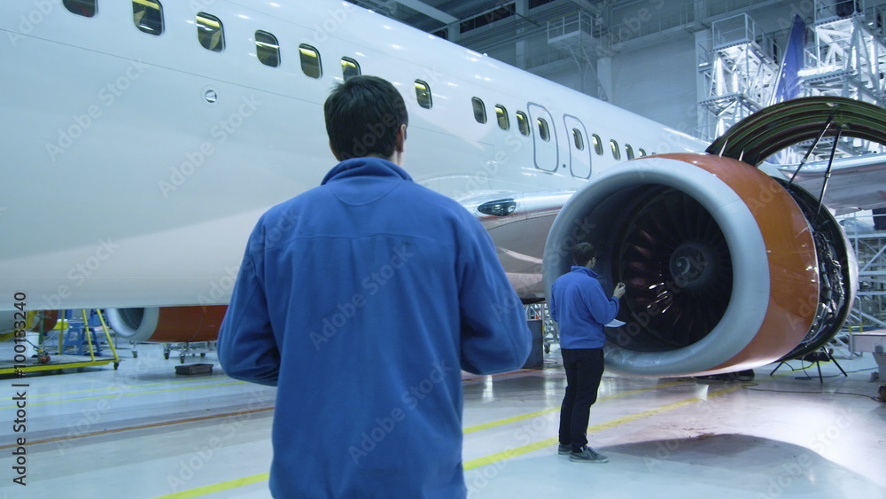 Video „Aircraft maintenance mechanic in blue uniform is walking to ...