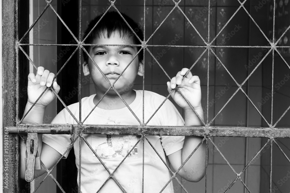 boy sad standing alone behind jail,black and white tone Stock Photo ...