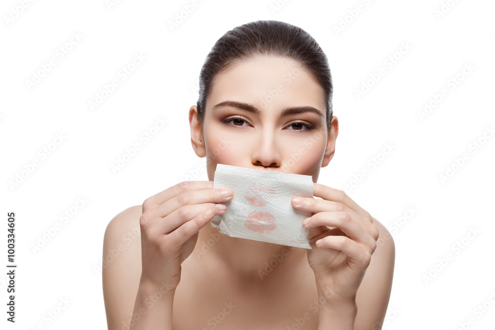 Beautiful girl wiping lips with tissue Stock Photo | Adobe Stock