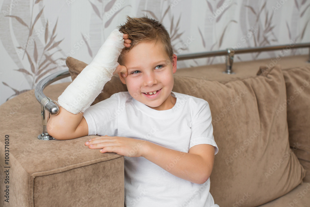 little boy with a broken arm. child in a cast. funny kid after accident ...