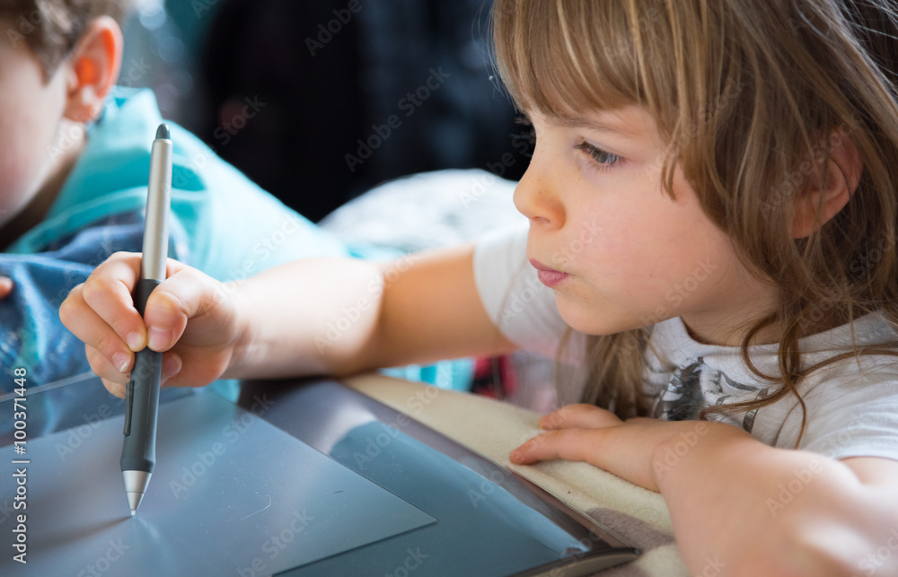 Girl drawing with graphic tablet Stock Photo | Adobe Stock