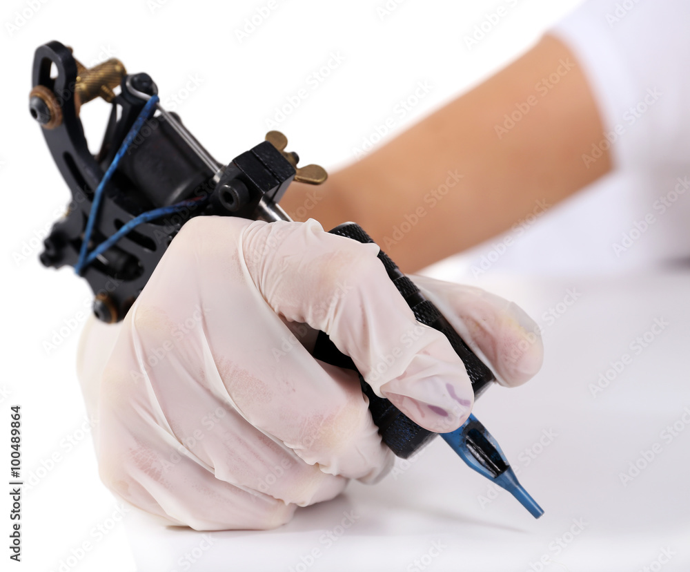 Tattoo machine in hand isolated on white background Stock Photo | Adobe ...
