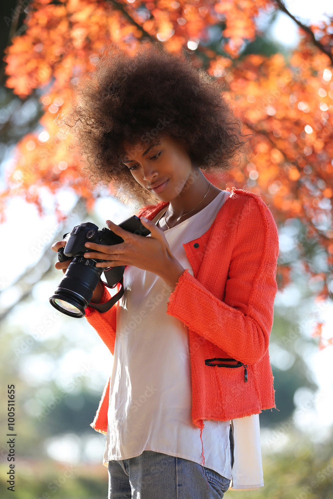 young african american black student laying in park during fall and ... young african american black student laying in park during fall and ...