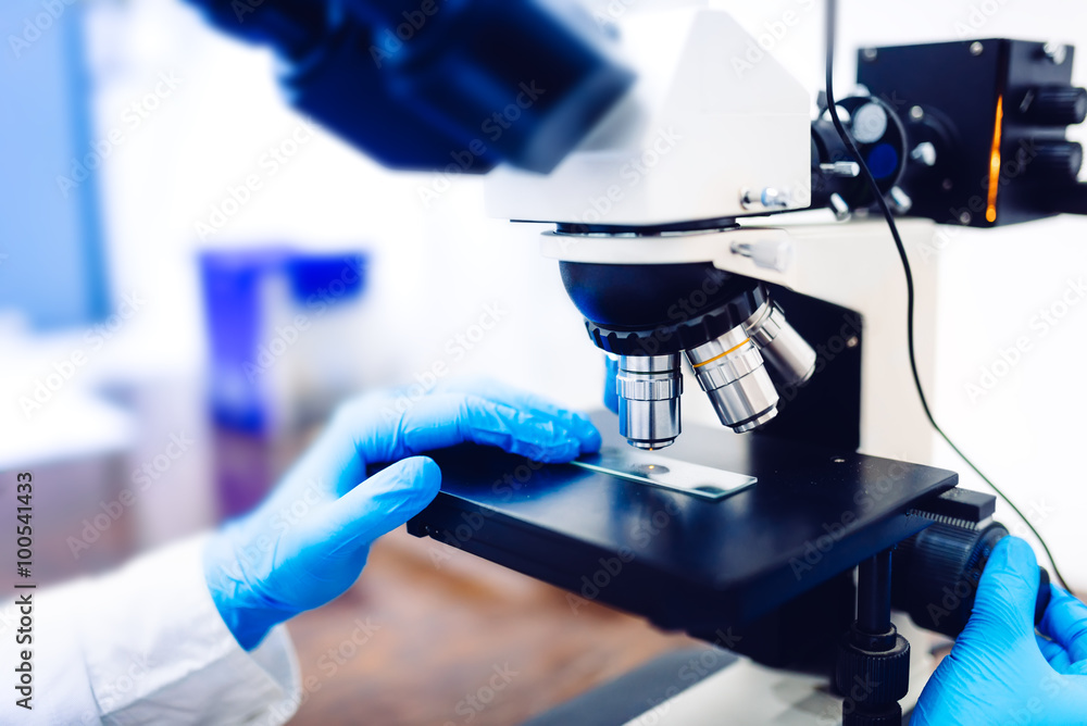 Details of medical laboratory, scientist hands using microscope for ...