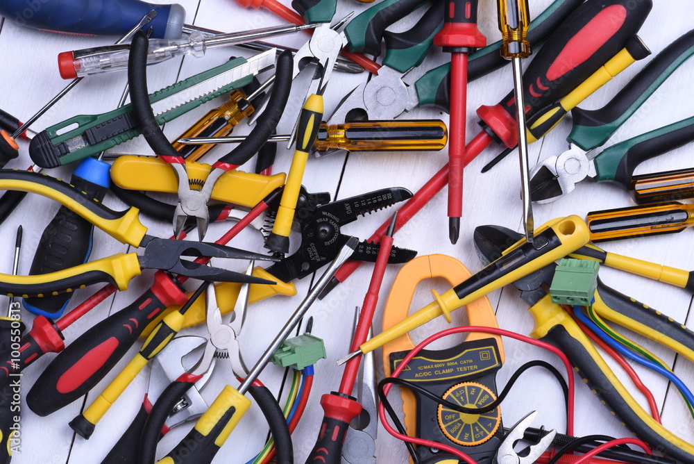 Tools to use in electrical installations on wooden background Stock ...