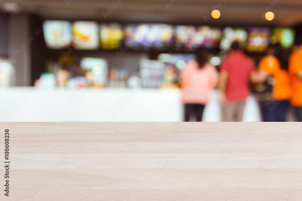 Plank wood or table top with blurred food shop background : Can use for ...