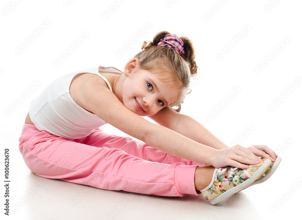Cute little girl doing gymnastic exercise Stock Photo | Adobe Stock