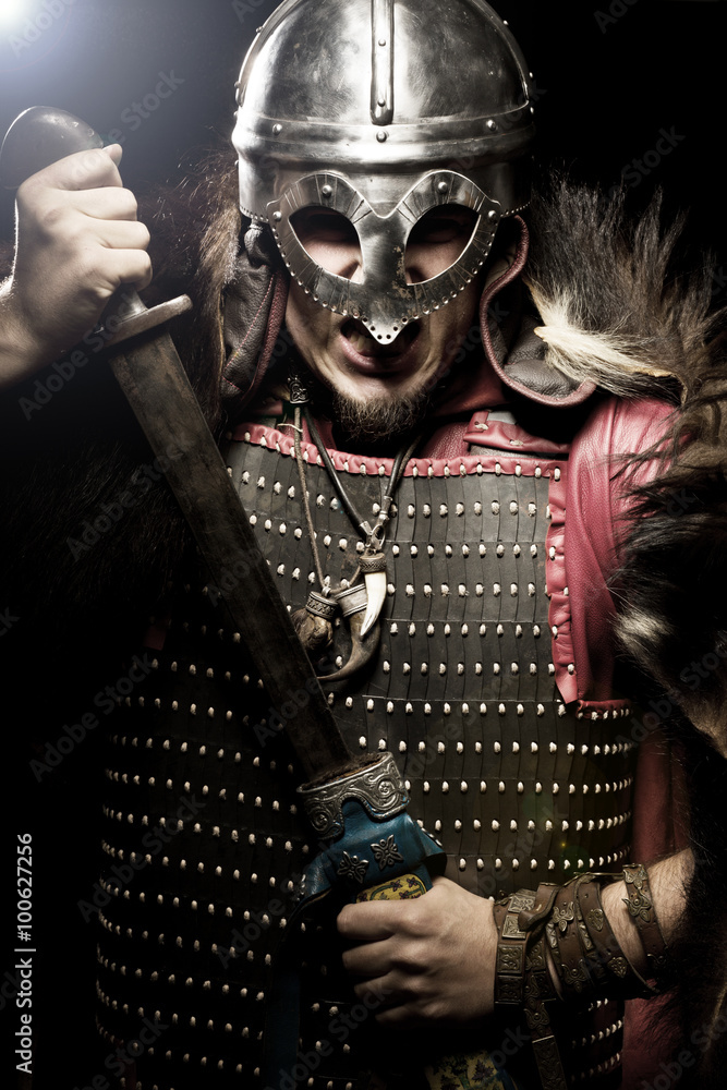 Shouting viking with sword and helmet over black background Stock 사진 ...