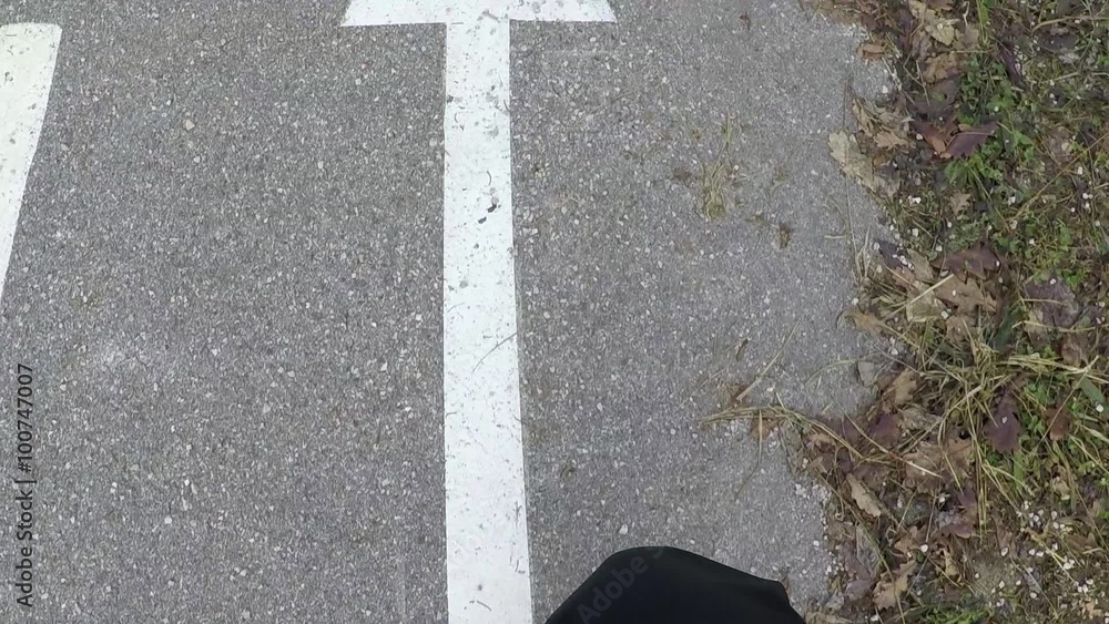 Vídeo do Stock: Woman walk straight on asphalt pedestrian pavement with ...