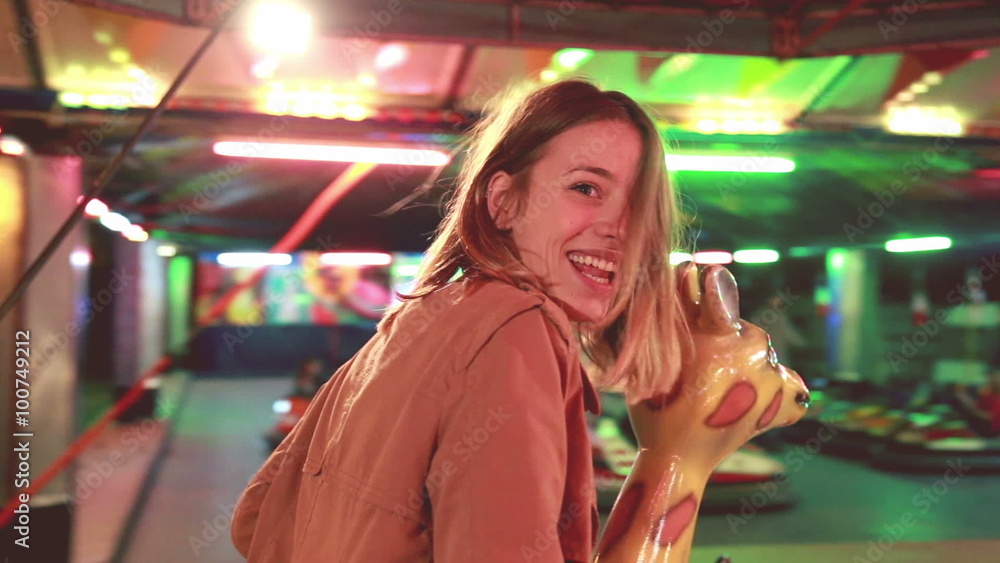 Beautiful woman having fun riding carousel in amusement park Stock ...