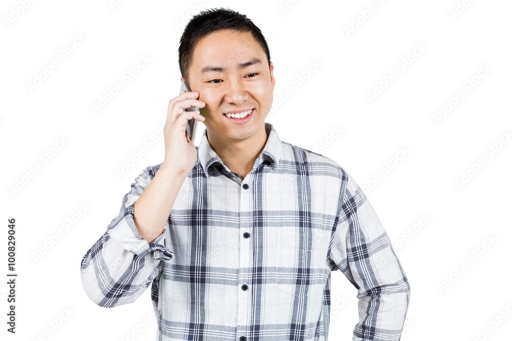 Foto de Asian man making a phone call do Stock | Adobe Stock