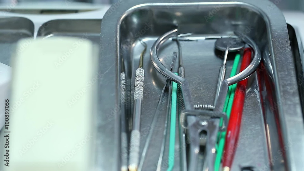 Dental Assistant Lays out Tools on Tray for Dentist to Use During ...