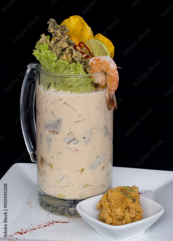 Ceviche called "leche de tigre" - peruvian fresh fish on glass. Stock ...