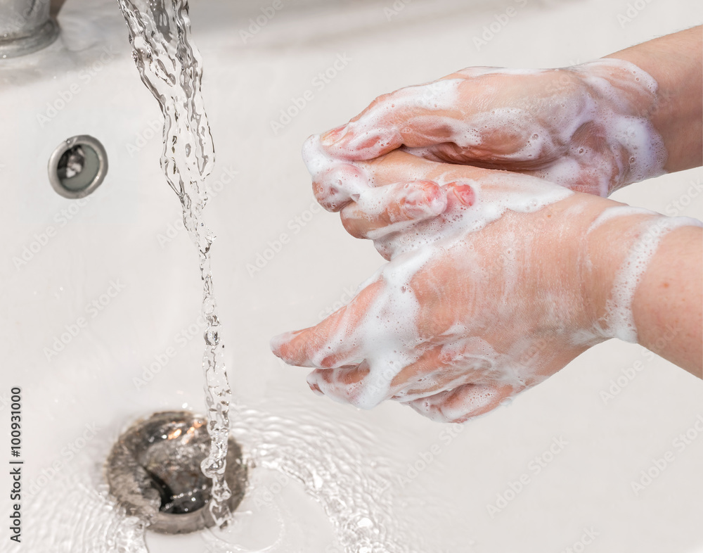 Washing hands with soap and water. Stock Photo | Adobe Stock