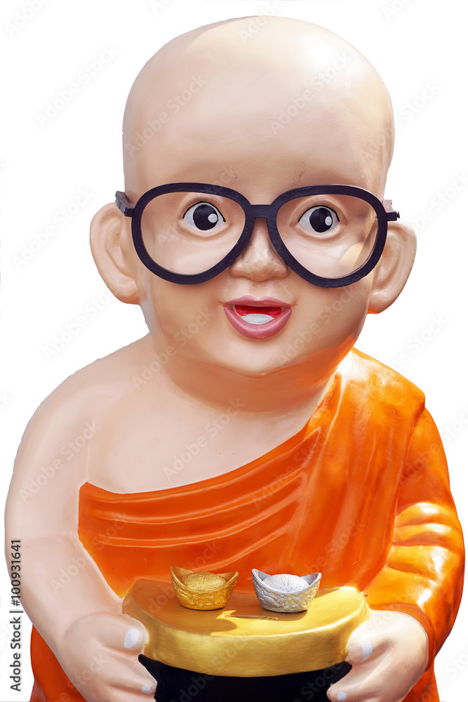 Child monk statue wear an eyeglasses. He's holding alms bowl with money ...