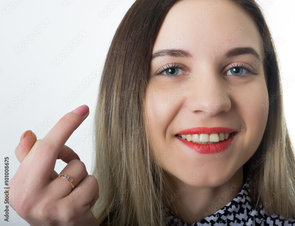 close-up beautiful sporty girl kissing middle finger. funny lifestyle ...