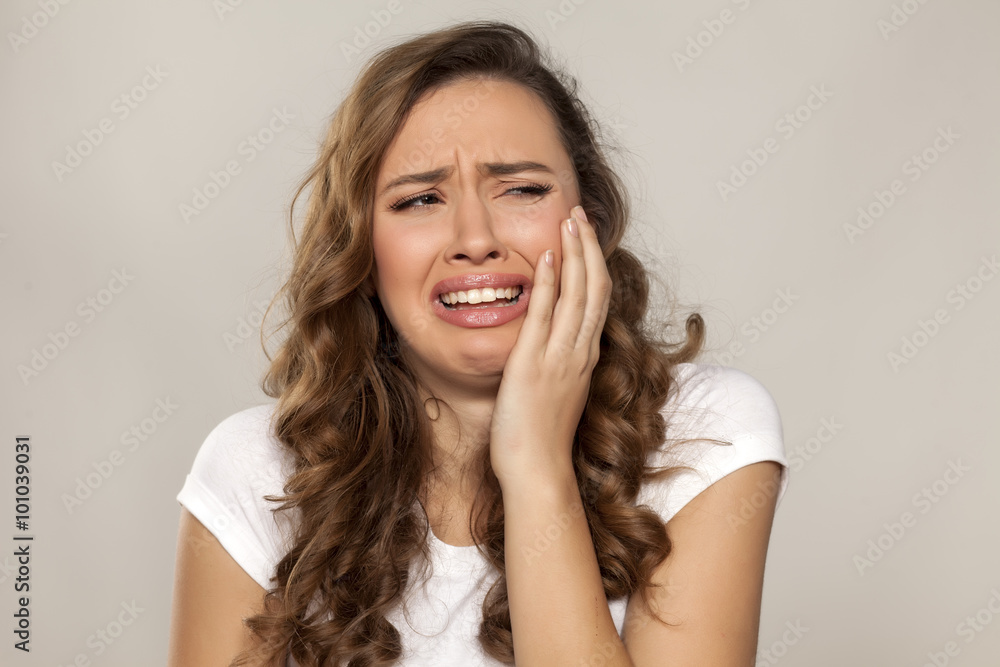 pretty girl crying because of toothaches Stock Photo | Adobe Stock