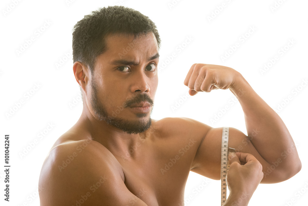Muscular man measuring up his biceps Stock Photo | Adobe Stock