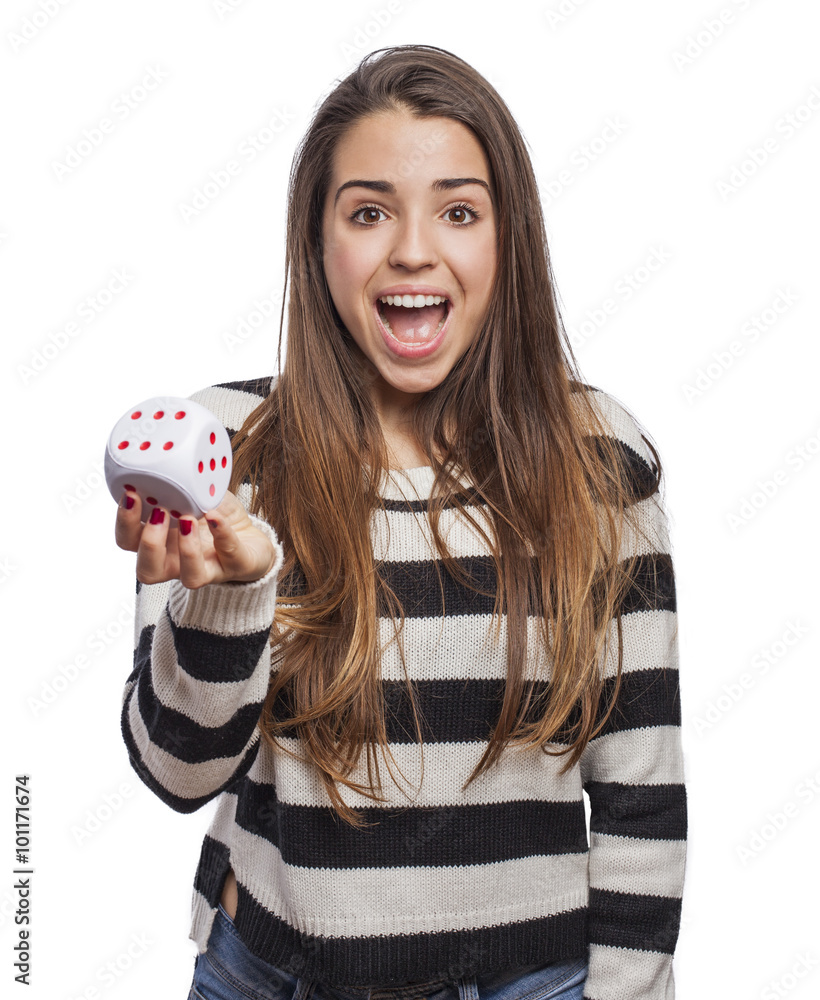 Happy and surprised young woman holding a dice Stock Photo | Adobe Stock
