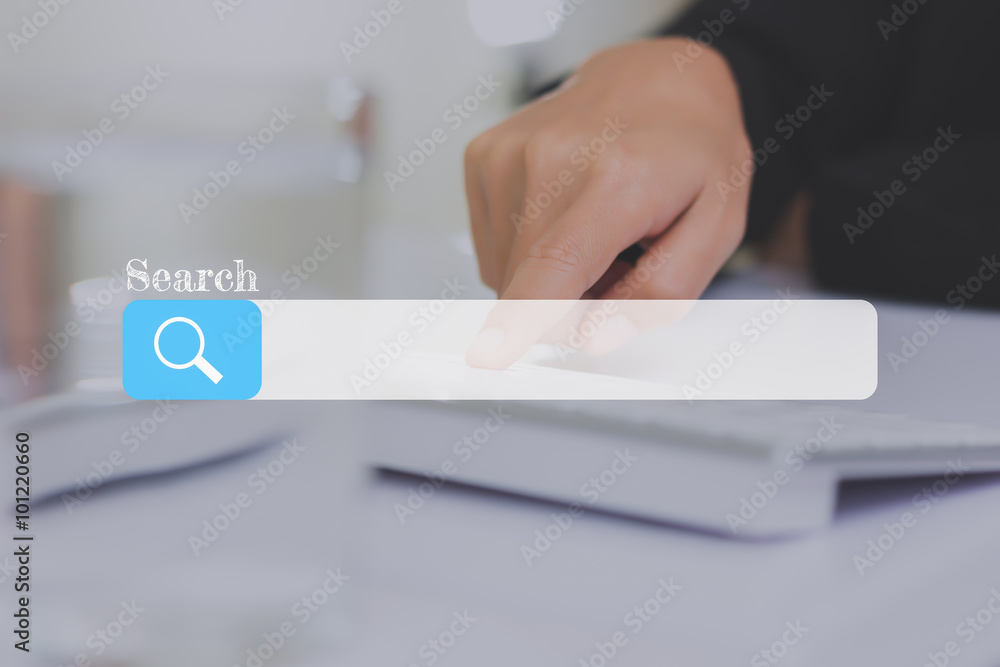 search bar on a virtual screen with his finger activating a global ...