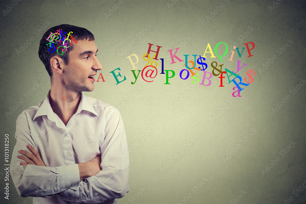 Side view portrait man talking with alphabet letters in his head coming ...