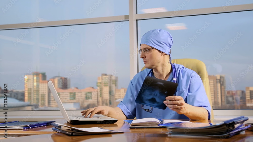 doctor at a clinic in his office prescribes treatment Stock Video ...