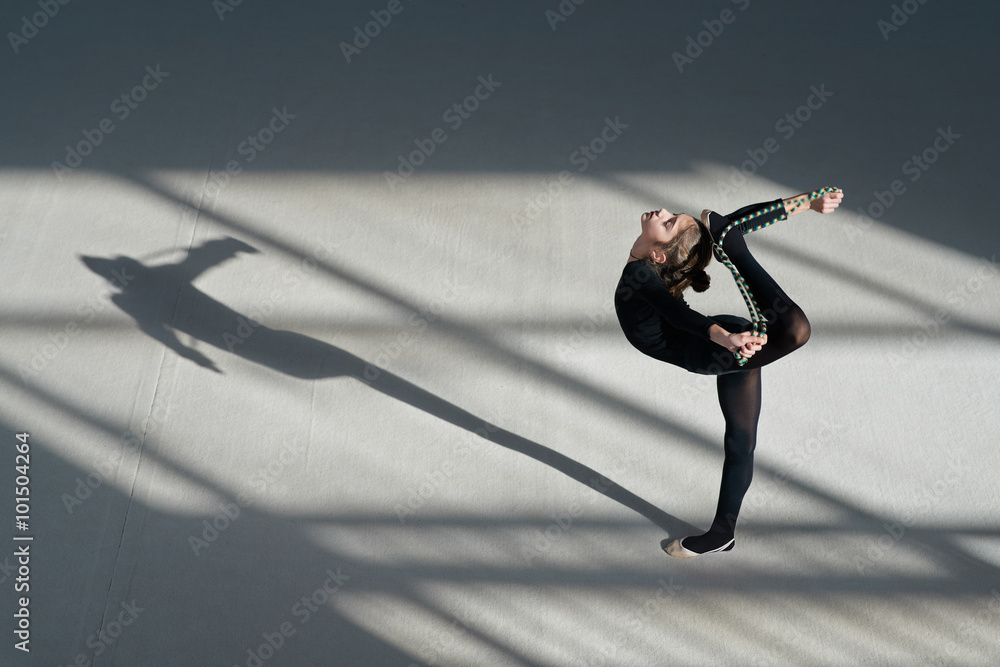girl making balance rope. rhythmic gymnastics. Stock Photo | Adobe Stock