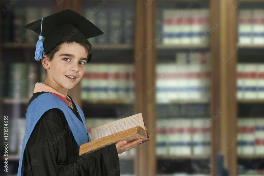 child graduation cap and books in the library Stock Photo | Adobe Stock
