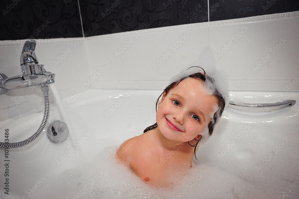 Sweet girl bathes in a bathroom Stock Photo | Adobe Stock
