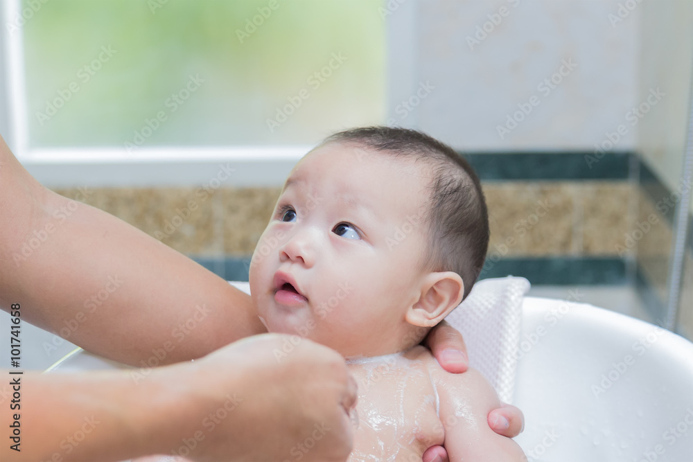 Newborn baby having a bath ,have fun in the bath time Stock Photo | Adobe Stock