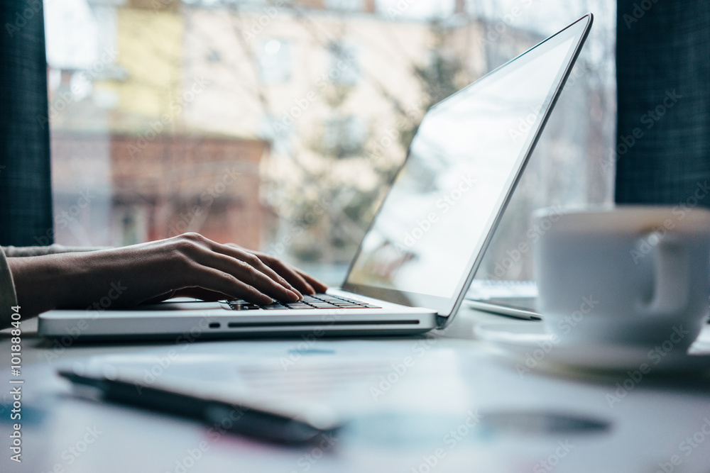 Female person sitting front open laptop computer and typing Stock Photo ...