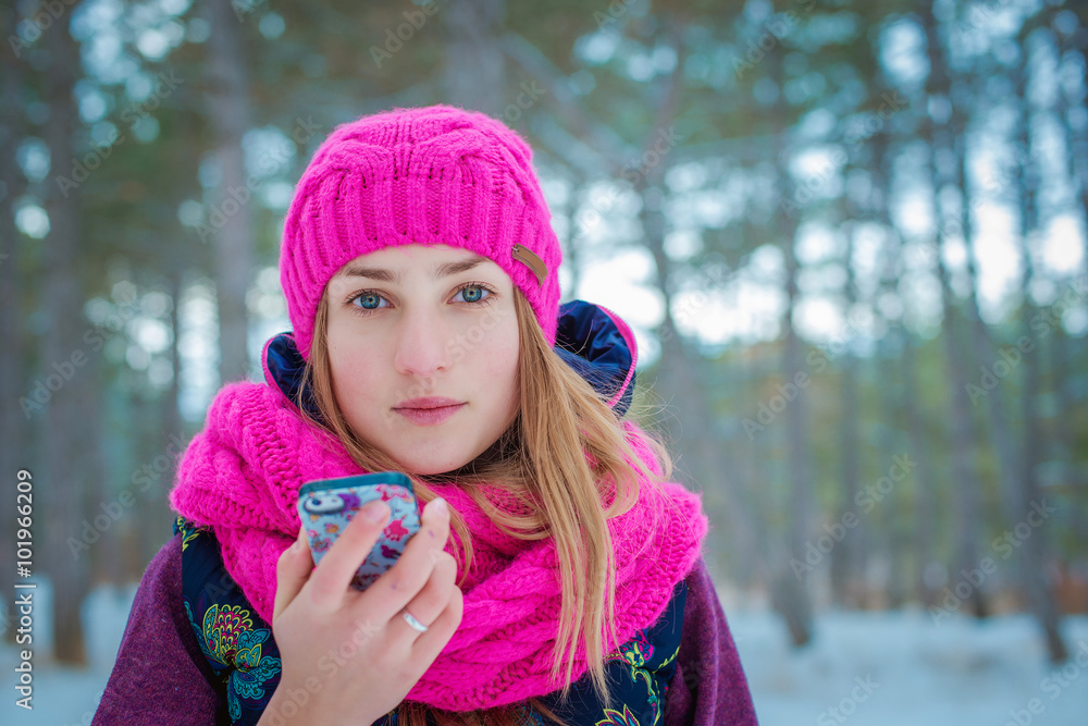 herself. beautiful girl taking photos herself n the winter outdoors ...