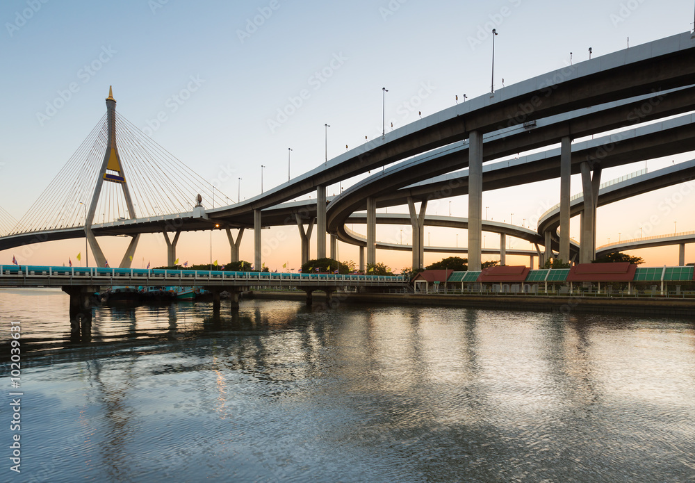 Curve of suspension bridge and hight way interchanged at riverside in ...