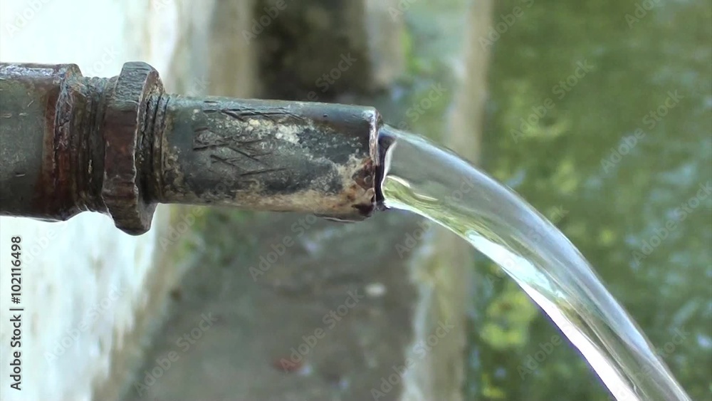 Spring water pouring from a pipe Stock Video | Adobe Stock