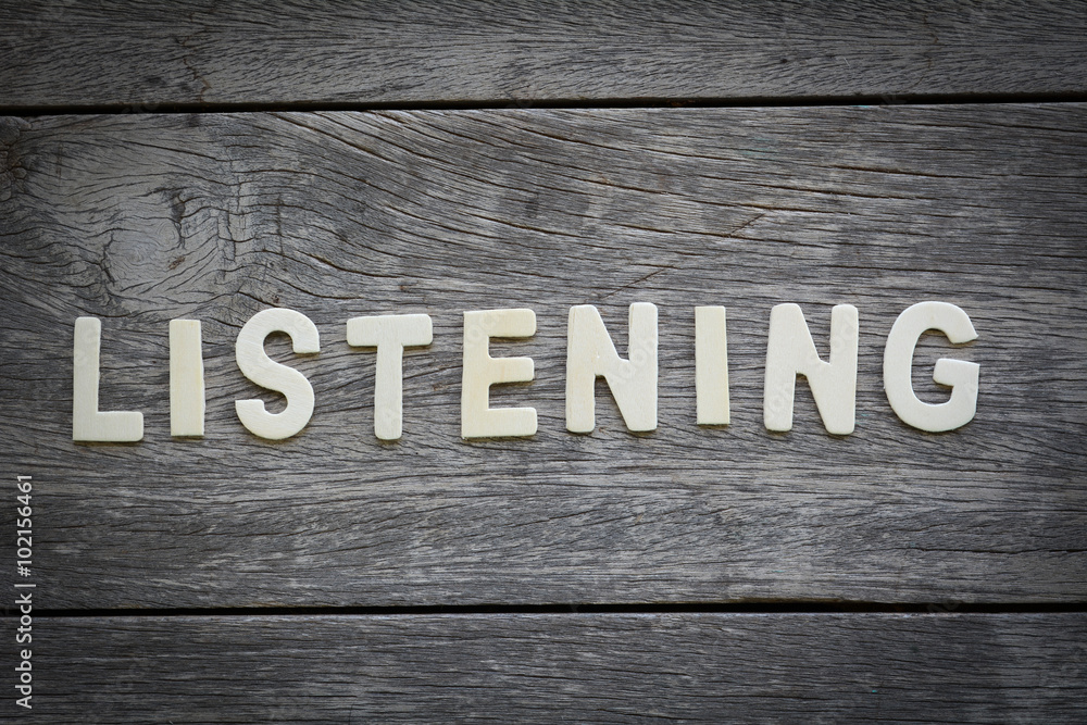 The word listening on the wooden floor Stock Photo | Adobe Stock