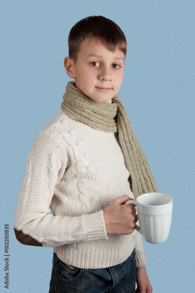 Cute boy with a cup on blue background Stock Photo | Adobe Stock