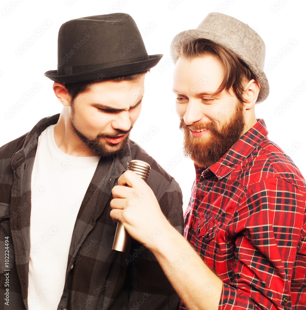 Foto Stock young mens singing with microphone | Adobe Stock