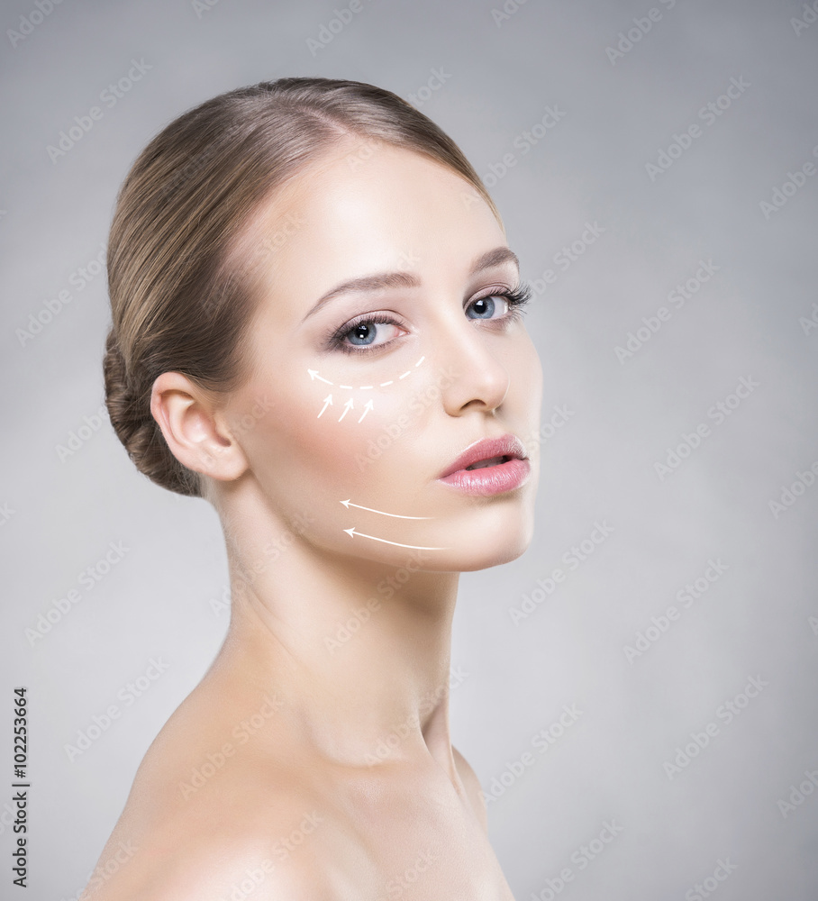 Attractive girl with smooth skin over the grey background. Stock Photo ...
