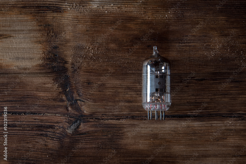 vacuum tube on the old wood background Stock Photo | Adobe Stock