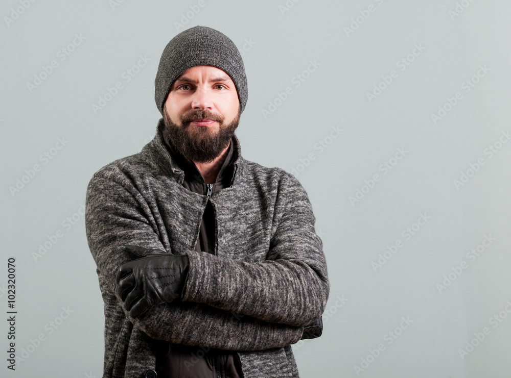 Attractive young bearded man keeping arms crossed and smiling Stock ...