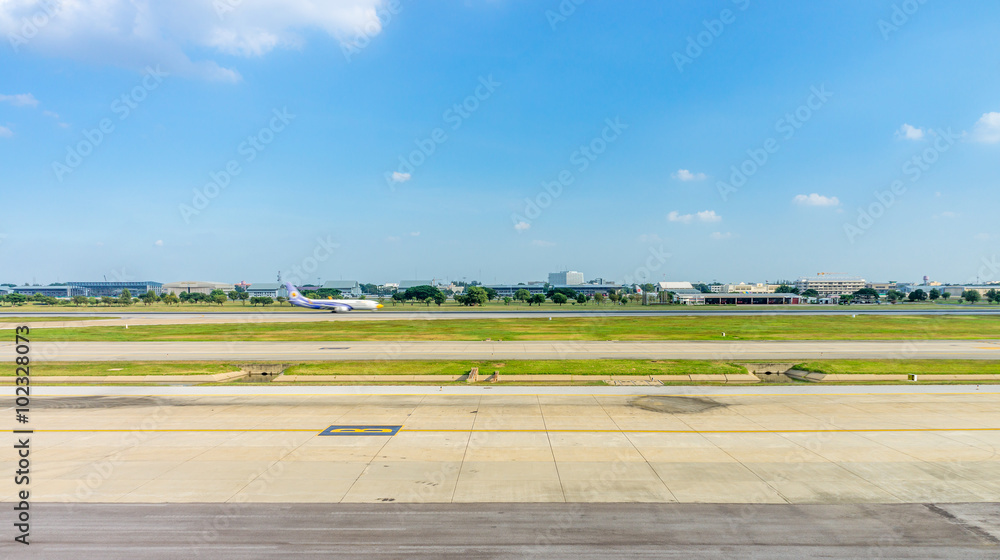 Scenery view of an airport. It consists of runway, taxiway and apron ...