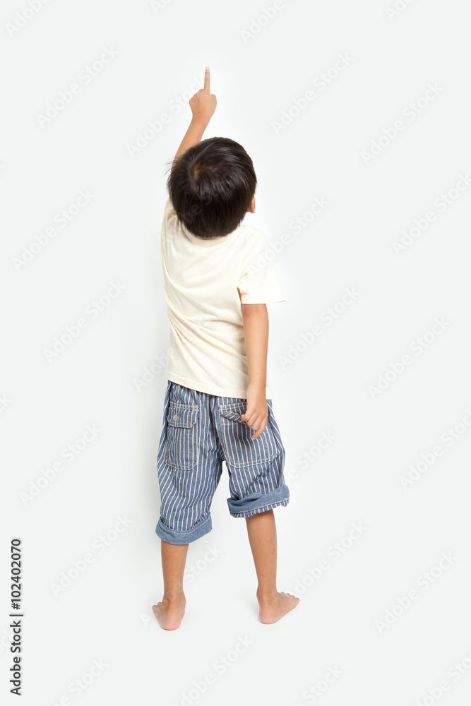 child pointing at wall. Back view. Isolated on white background Stock ...