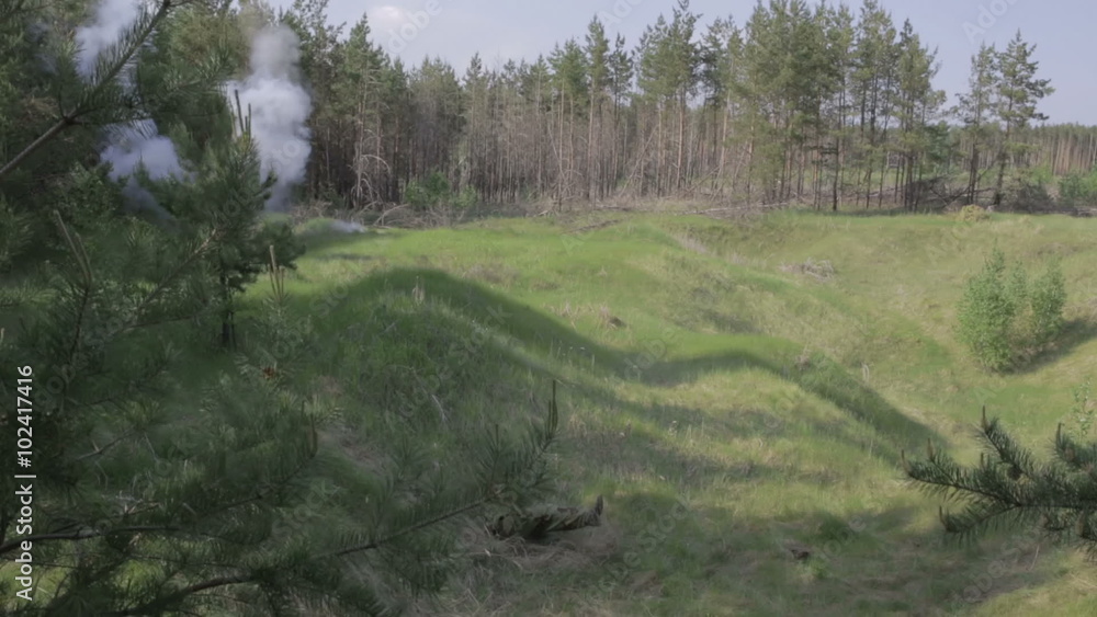 Combat firefight in the woods. World war II. The reconstruction of the ...