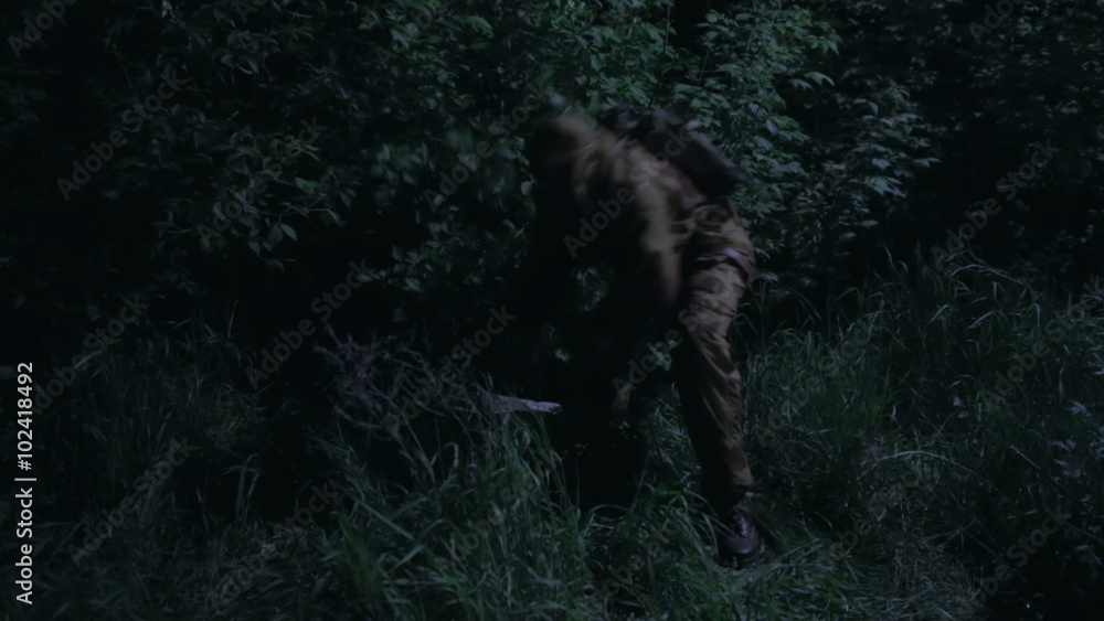 Paratroopers parachute hiding in the bushes. World war II. The ...