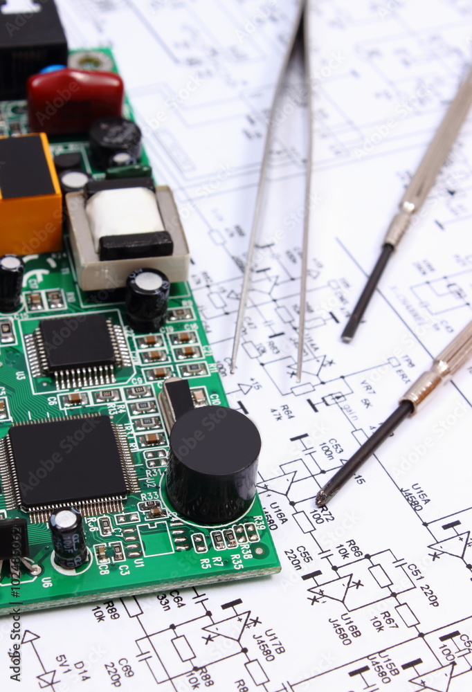 Printed circuit board and precision tools on diagram of electronics ...