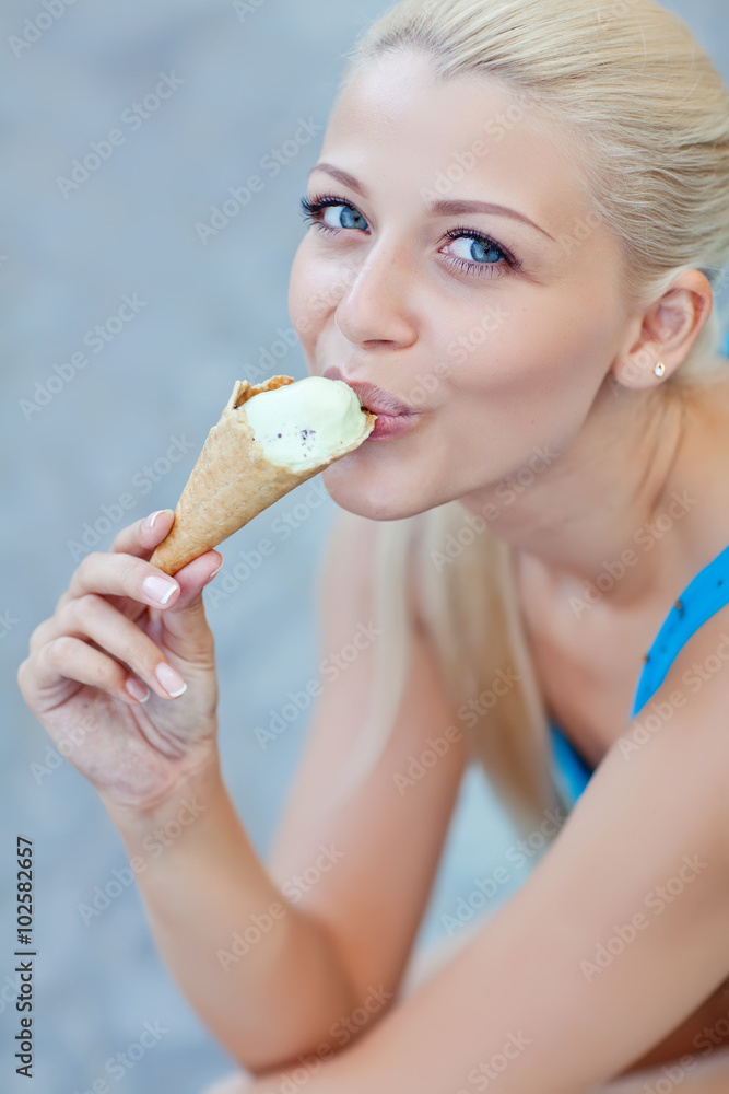 Beautiful woman with ice-cream Stock Photo | Adobe Stock